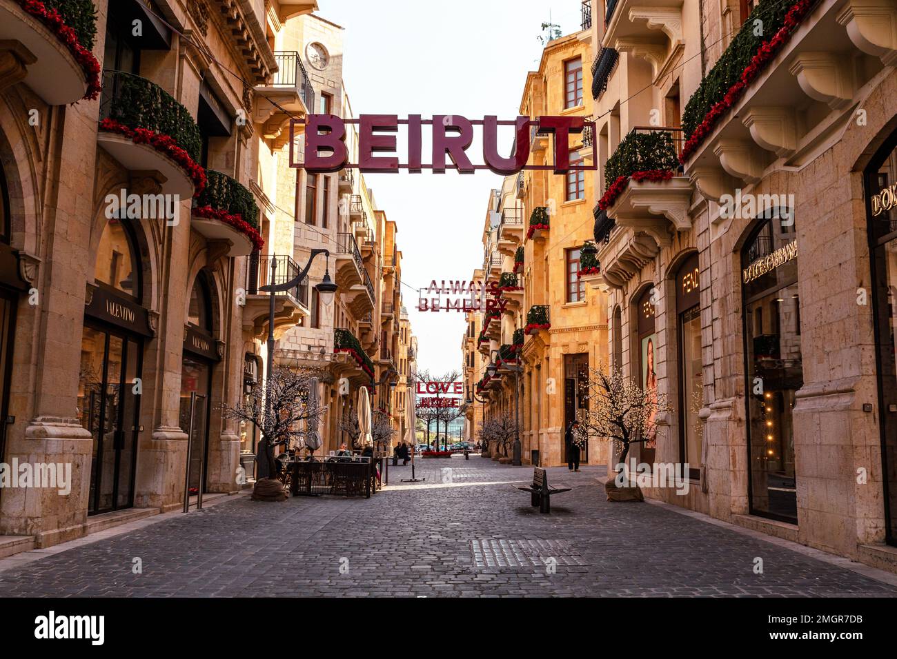 Popular commercial street in Beirut old city. Large hanging inscription ...