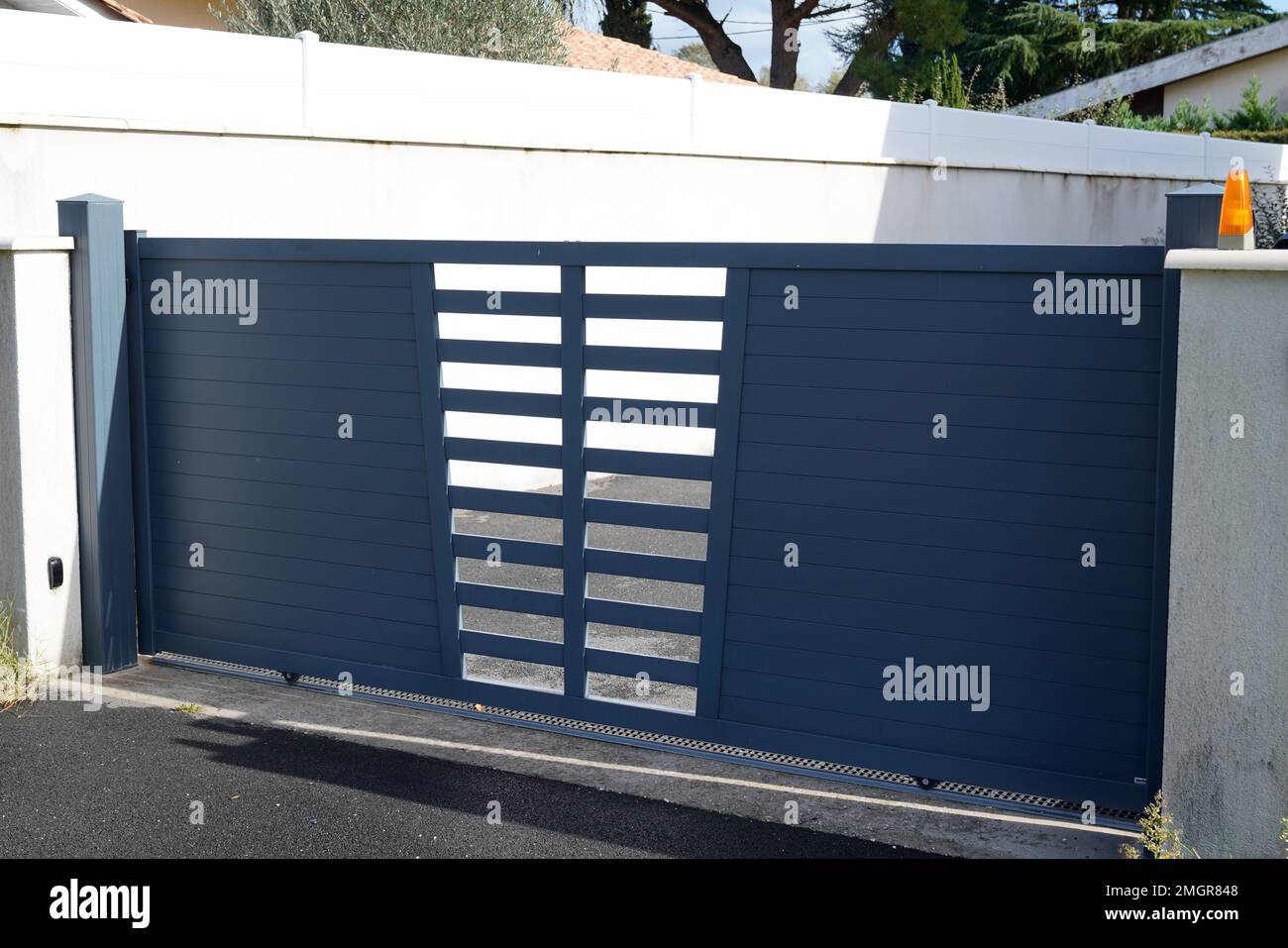 Aluminum grey large car gate gray of modern house in street view Stock ...