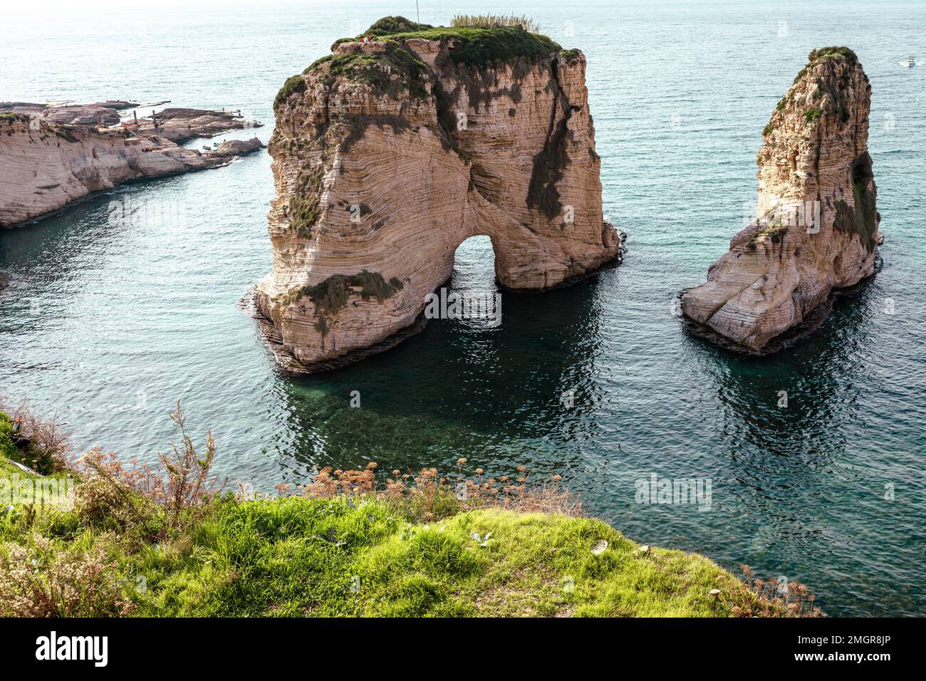 Raouche Rocks in Beirut, Lebanon in the sea during daytime. Pigeon ...