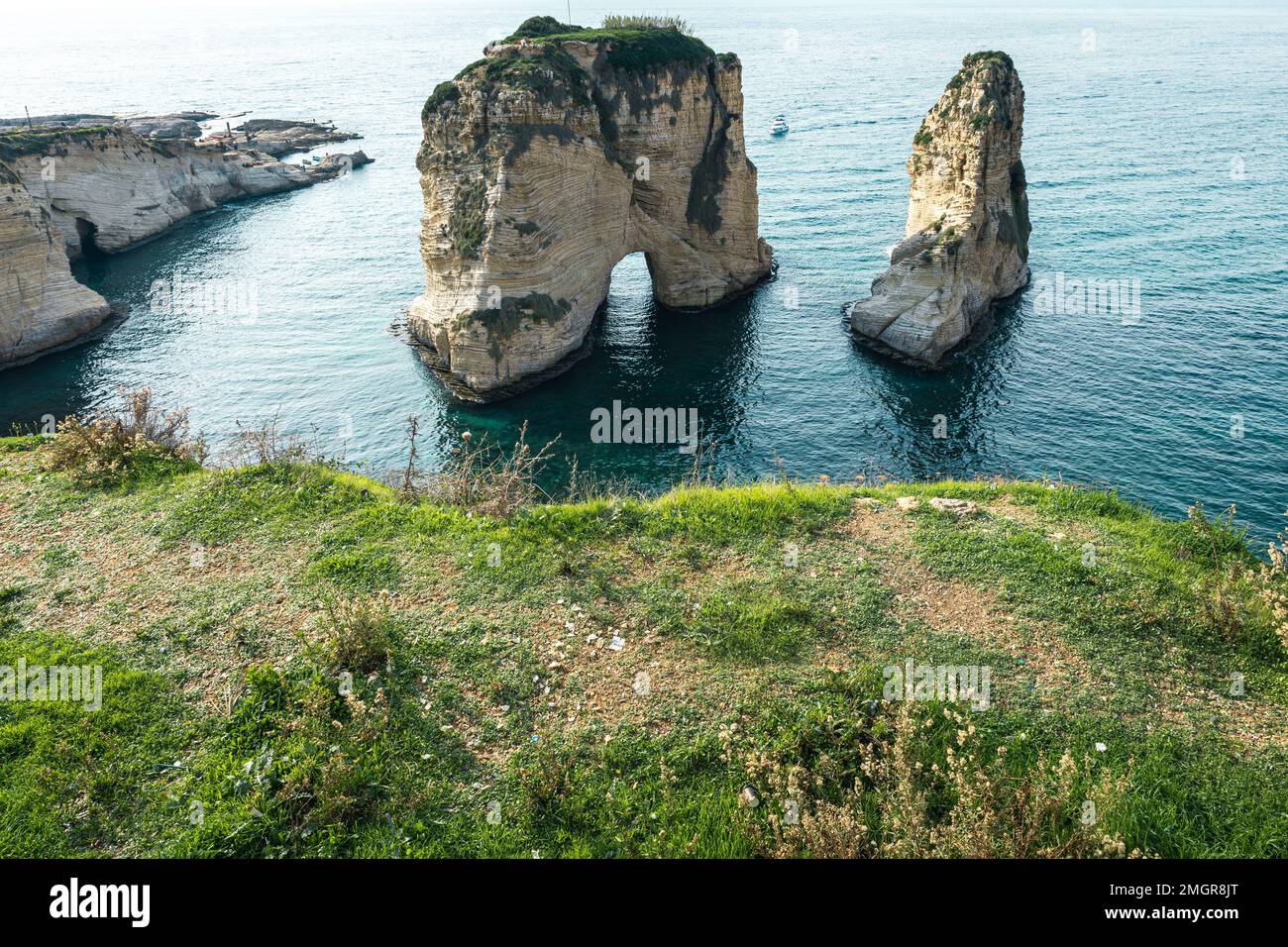 Raouche Rocks in Beirut, Lebanon in the sea during daytime. Pigeon ...