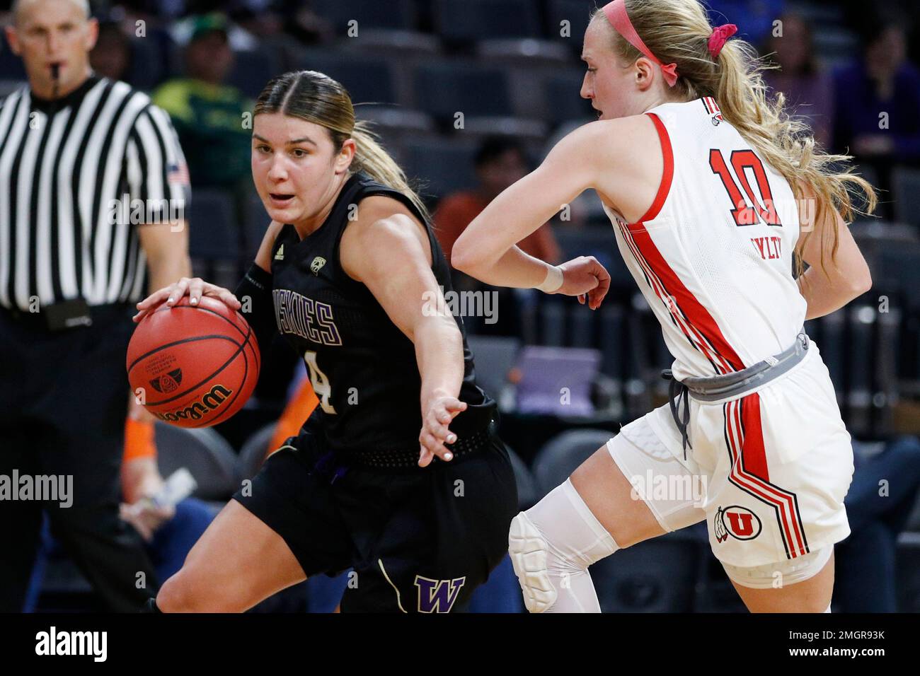 Washington's guard Amber Melgoza (4) drives around Utah's guard Dru ...