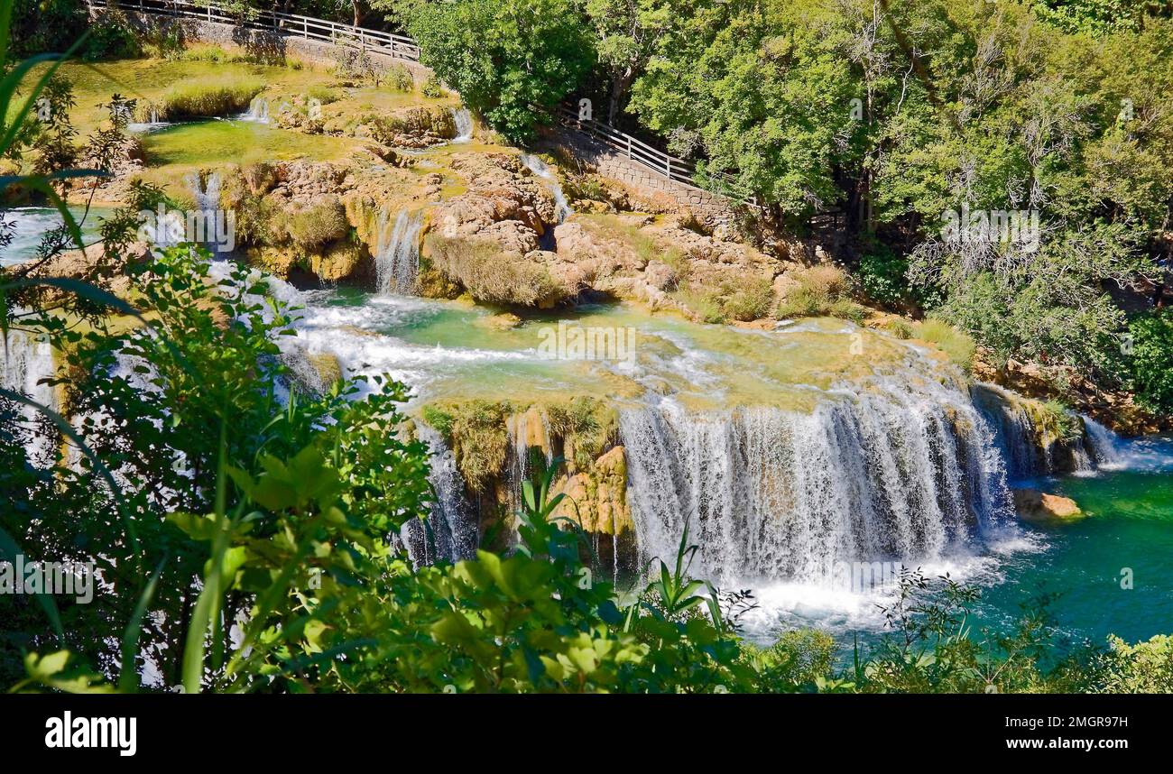 multiple waterfalls; overview; nature; powerful; rocky terrain; scenic ...