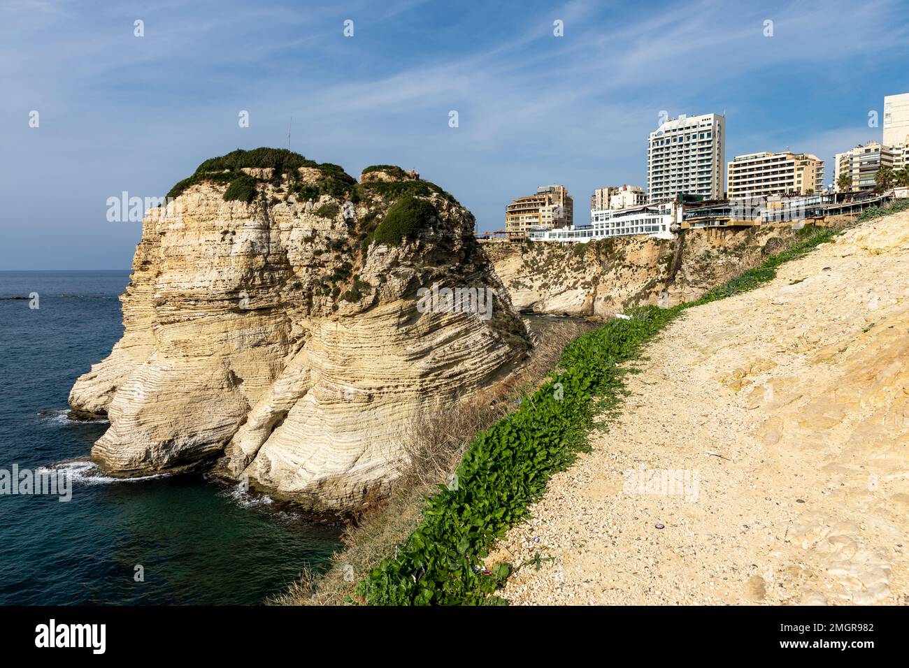 Raouche Rocks in Beirut, Lebanon in the sea during daytime. Pigeon ...
