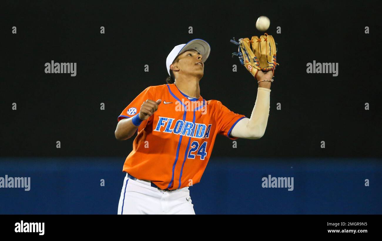 Florida infielder Josh Rivera (24) catches a fly ball during an NCAA ...