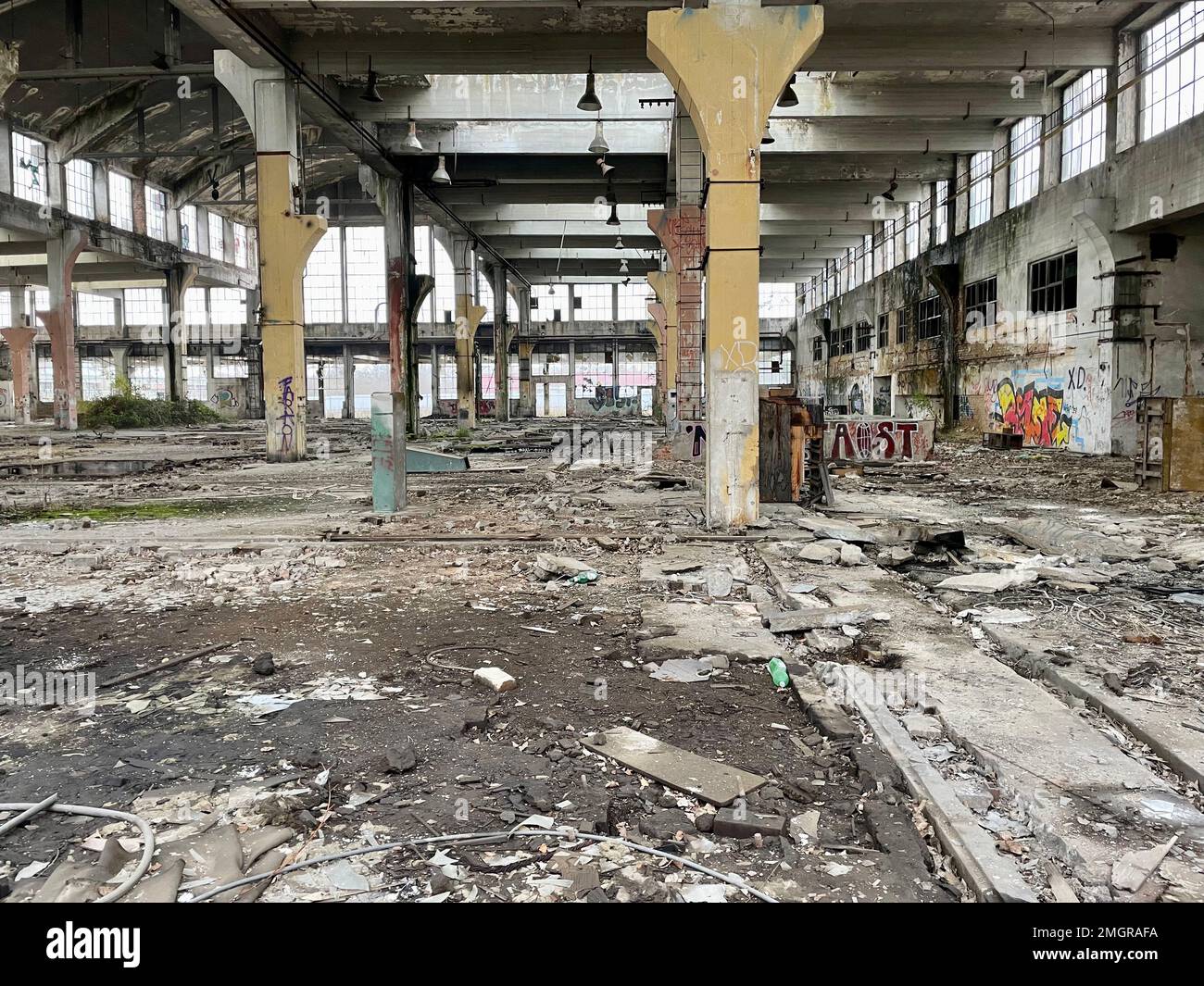 Interior of abandoned industrial hall from an old factory full of mess ...