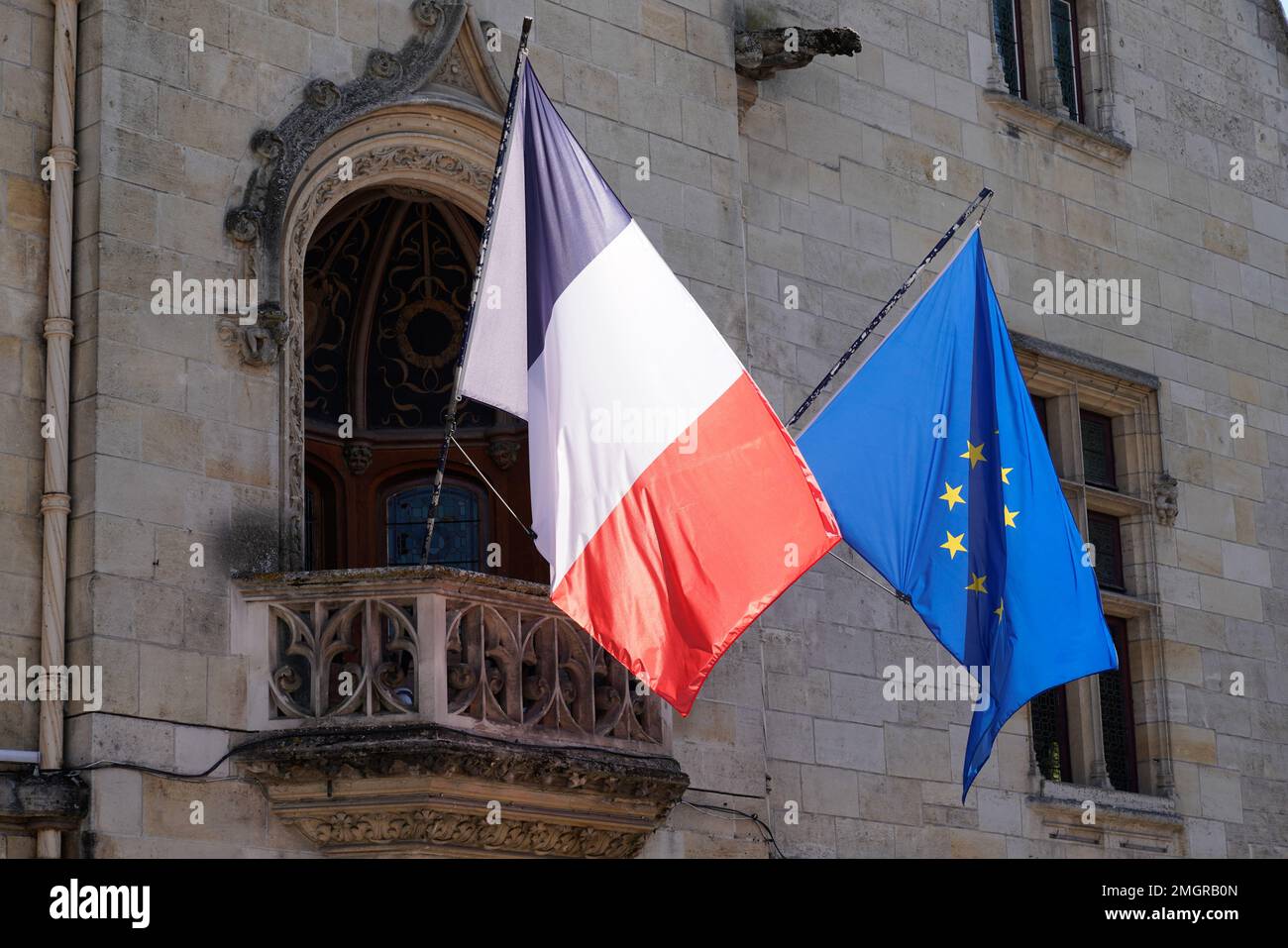 French and european eu flag waving in mat front of city hall in town of ...
