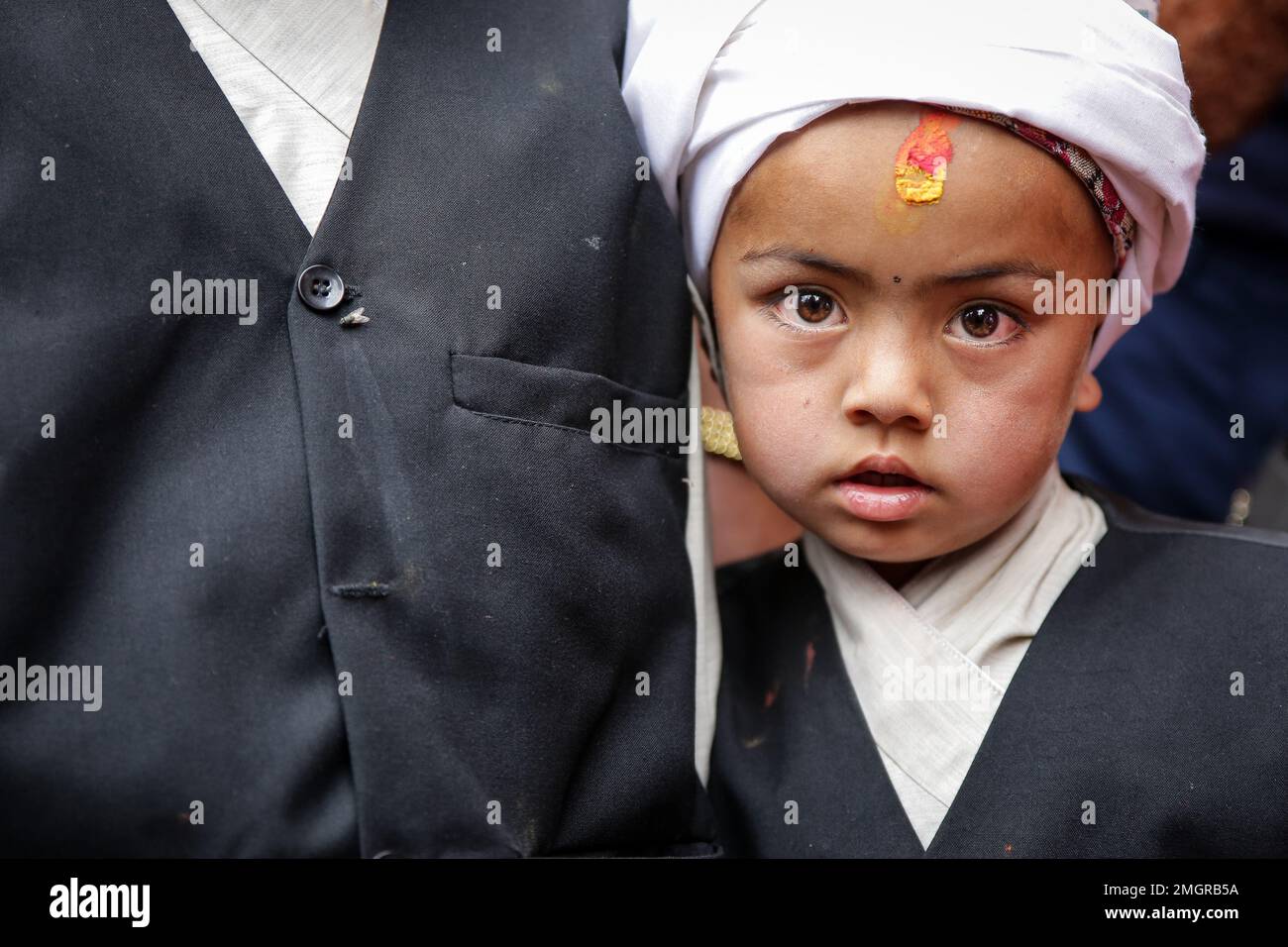 Nepal. 26th Jan, 2023. A boy stares at the camera during Bratabandha ...
