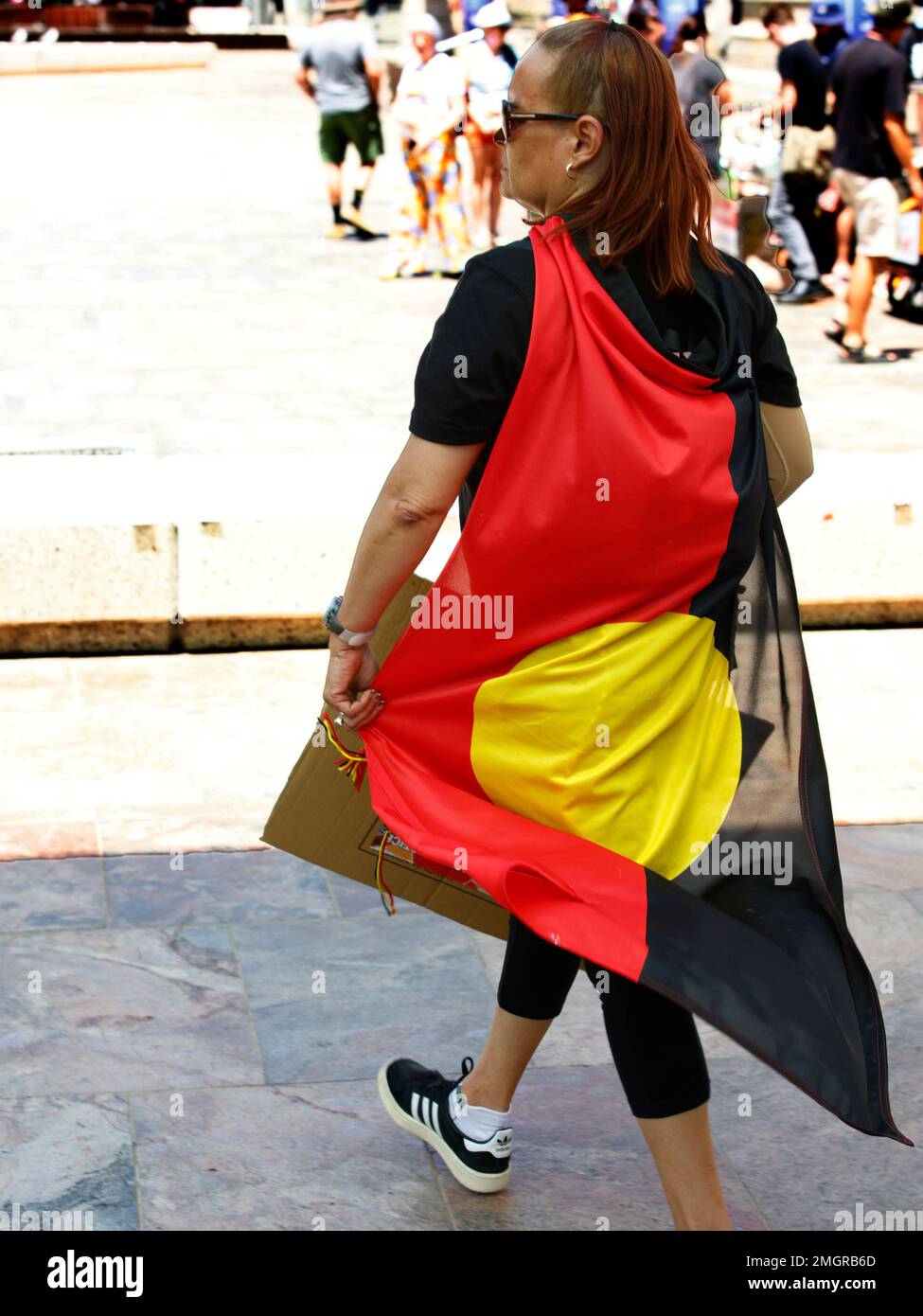 Perth, WA, Australia. January 26th 2023. Woman draped in an aboriginal ...