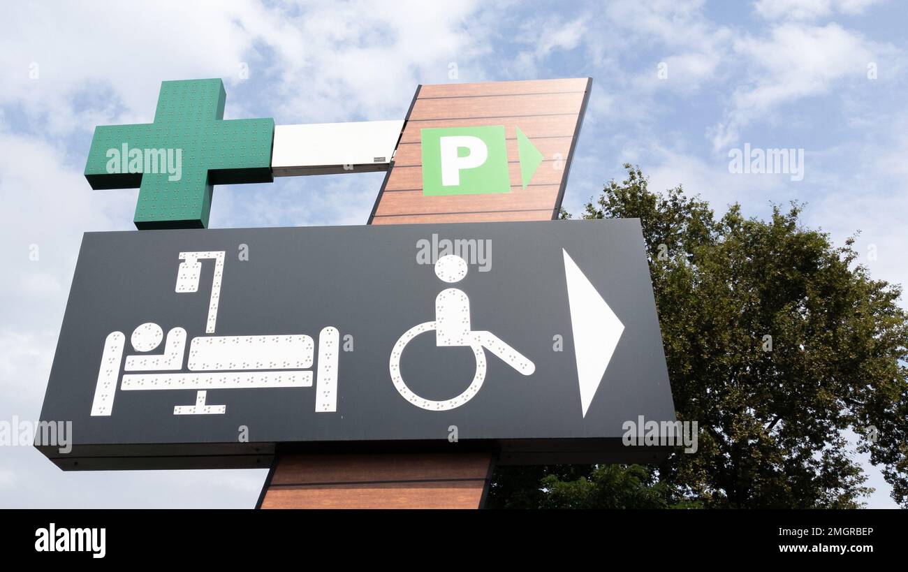 Pharmacy sign green cross store and hospital equipment and wheelchair ...
