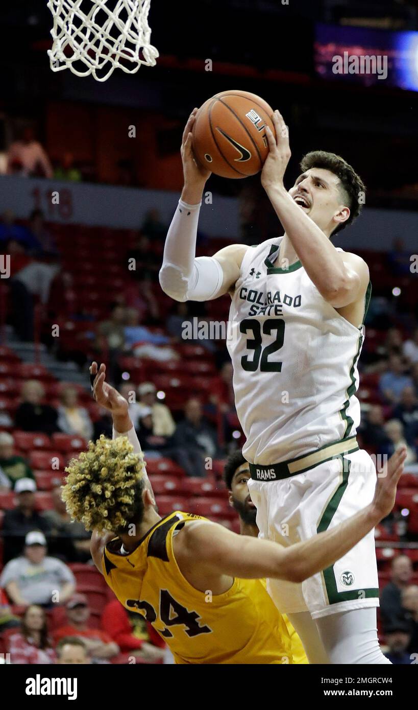 Colorado State's Nico Carvacho (32) shoots as Wyoming's Hunter ...