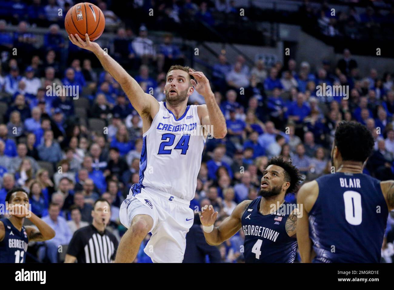 Creighton's Mitch Ballock (24) goes for a layup against Georgetown's ...