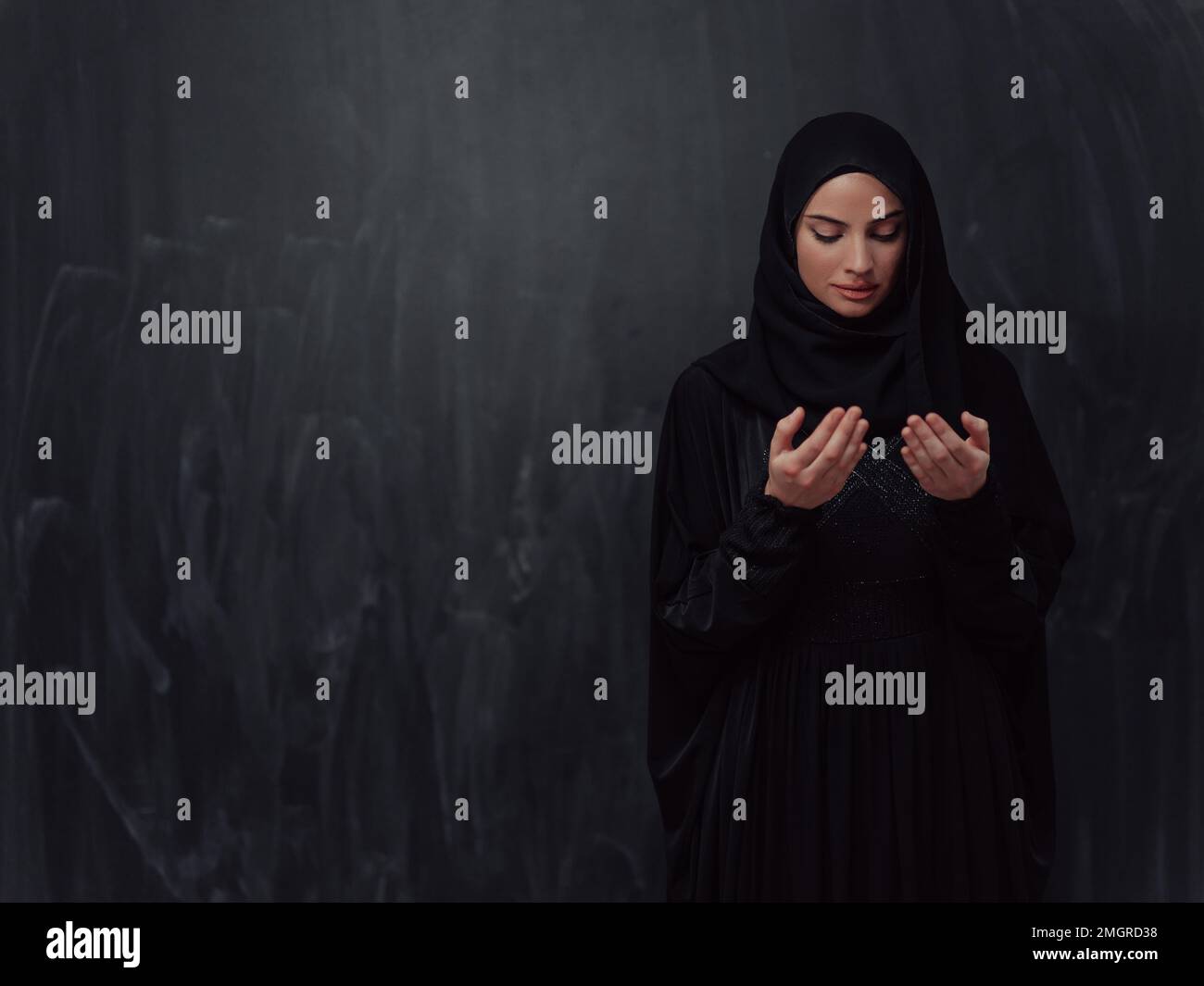 Portrait of young Muslim woman making dua Stock Photo - Alamy