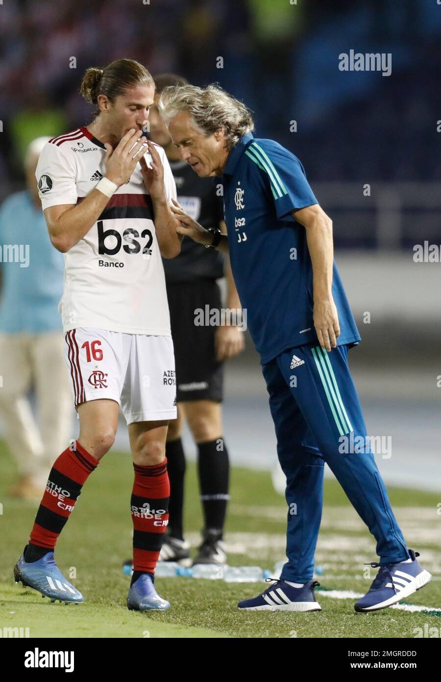 Filipe Luis of Brazil's Flamengo talks to coach Jorge Jesus during a ...