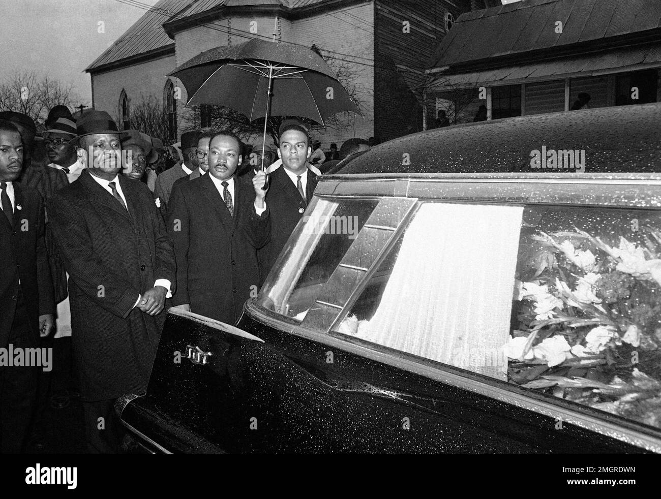 FILE - In this March 3, 1965, photo, the Rev. Martin Luther King Jr. leads a procession behind ...