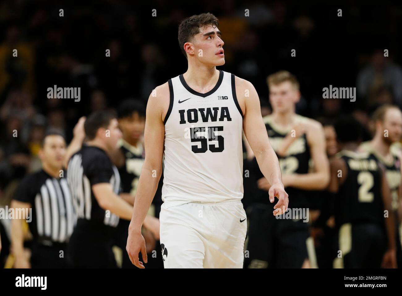 Iowa center Luka Garza walks on the court during an NCAA college ...