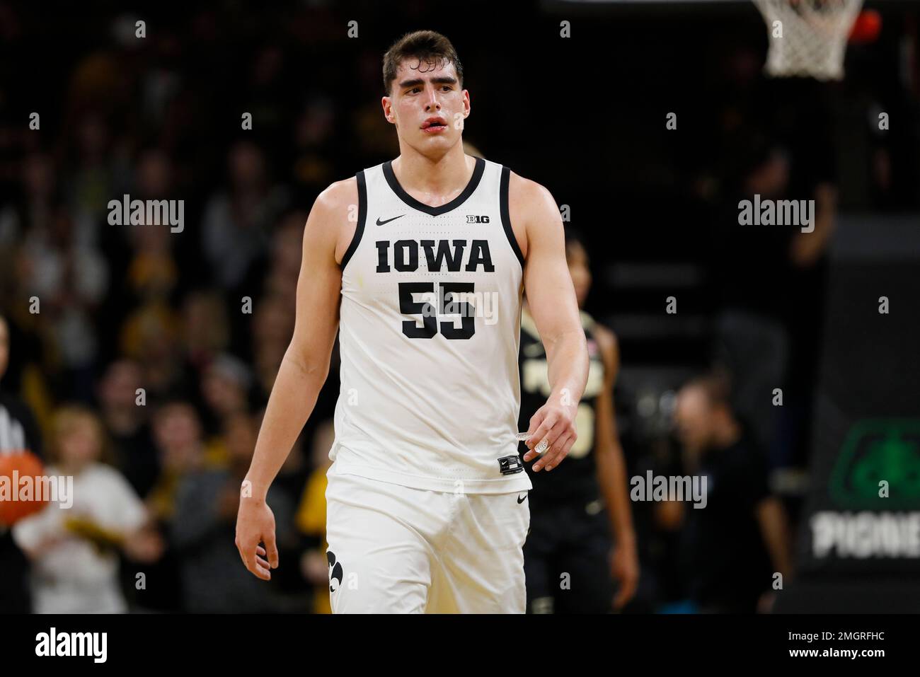Iowa center Luka Garza walks on the court during an NCAA college ...