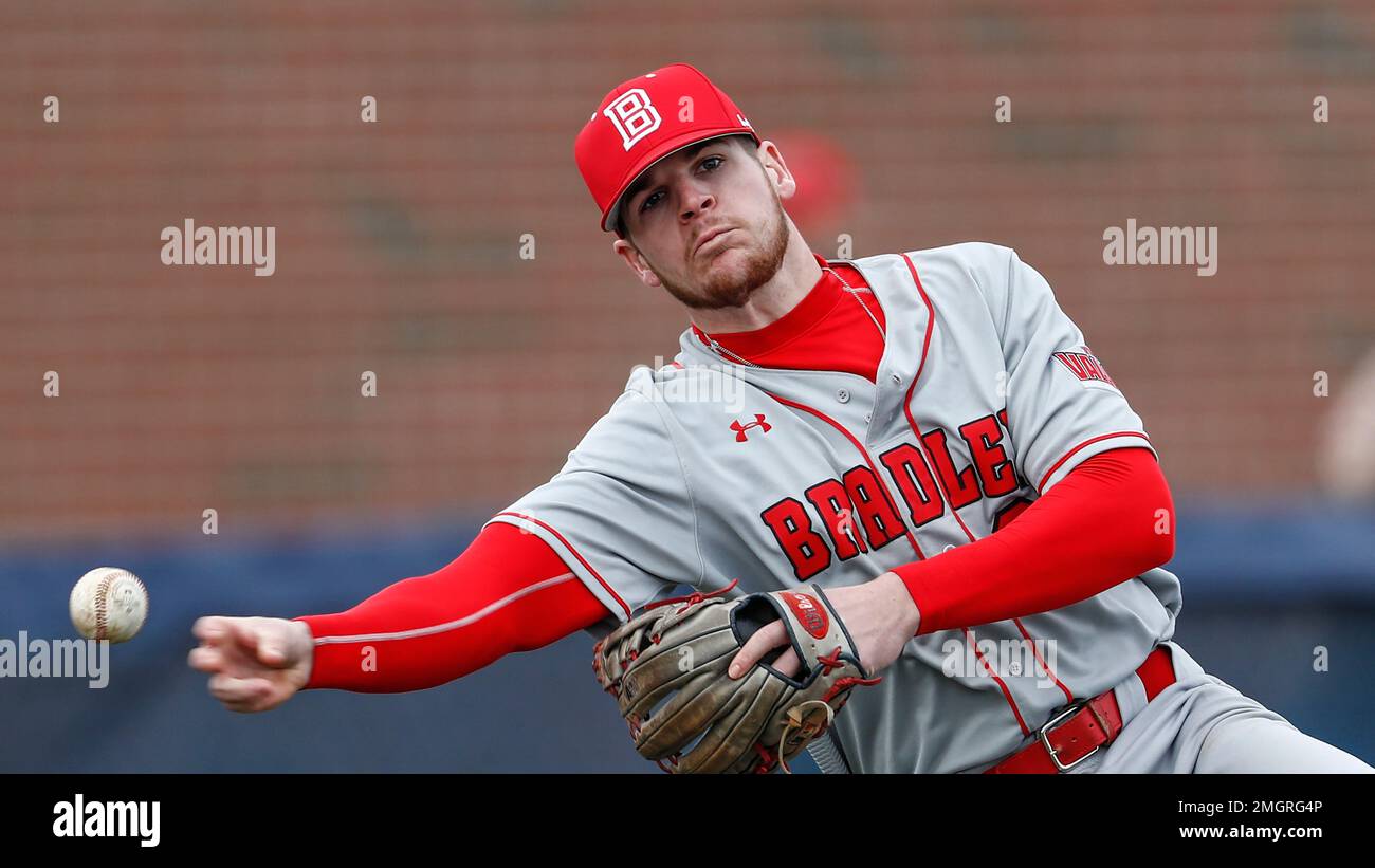 Bradley's Nic Anderson throws to first base during an NCAA baseball ...
