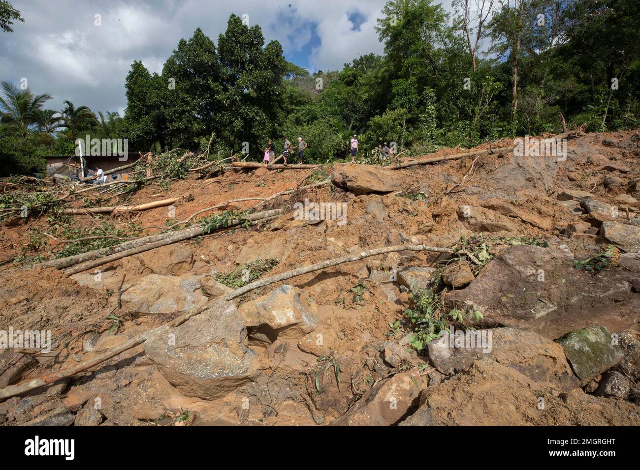 Mud covers an area where homes once stood in the coastal city of ...