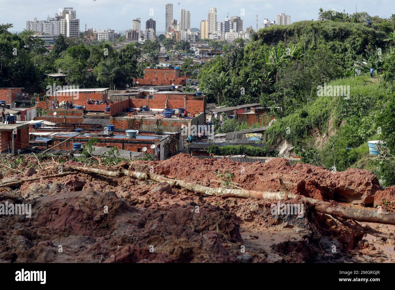 Mud covers an area where homes once stood in the coastal city of ...