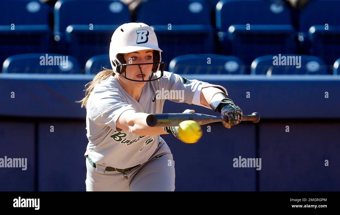 Binghamton Sara Herskowitz (32) bunts during an NCAA college softball ...