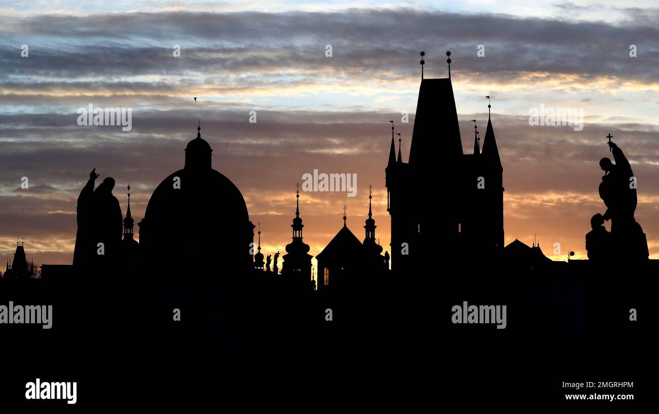 The sun rises over the medieval Charles Bridge in Prague, Czech ...