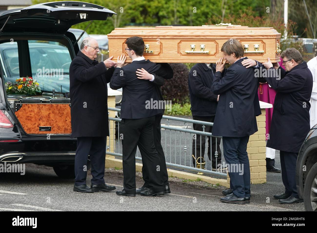 Pallbearers carry the coffin of Matthew Healy out of St Mary's Church ...