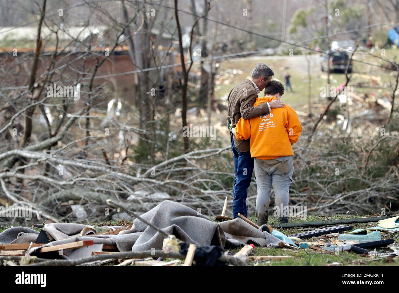 Tennessee Gov. Bill Lee, left, prays with Kayla Cowen, right, as Cowen ...