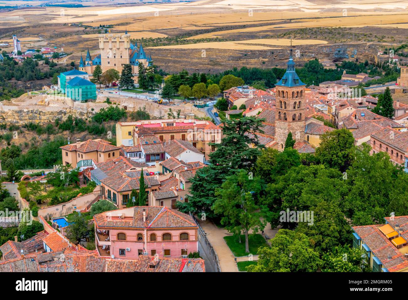 An aerial view of a small town shows colorful buildings in the center ...