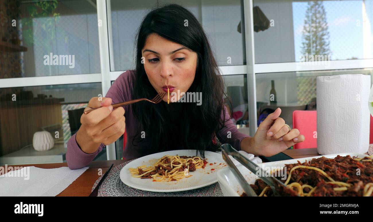 Woman eating pasta spaghetti for lunch Stock Photo - Alamy