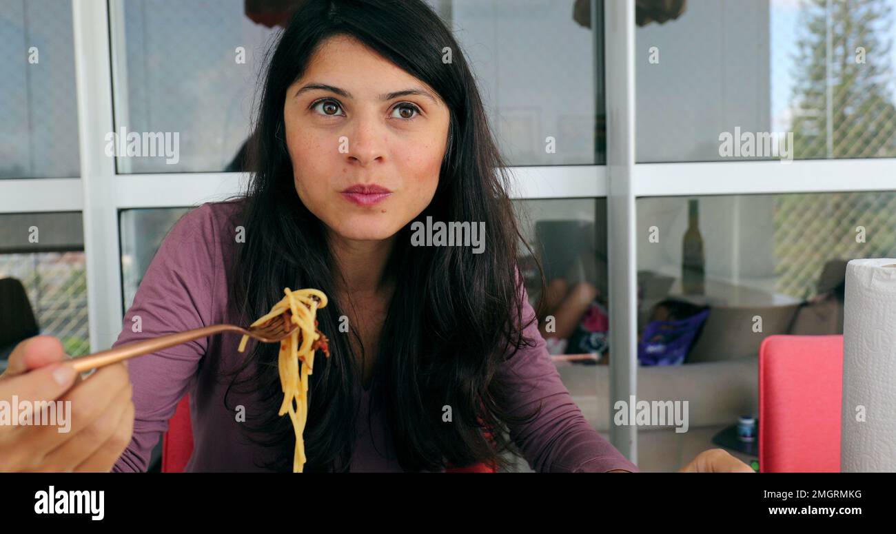 Woman eating pasta spaghetti for lunch Stock Photo - Alamy