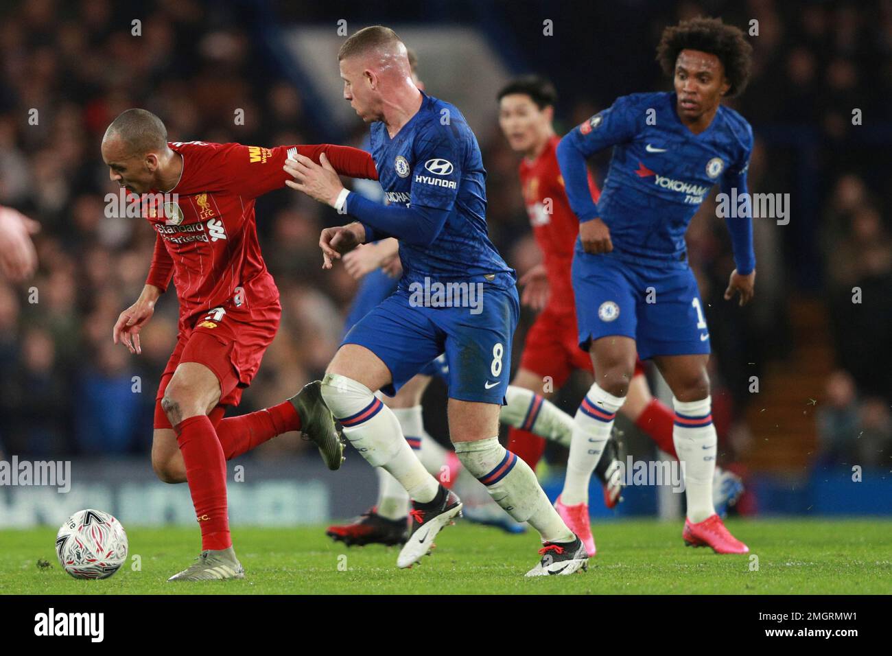 Liverpool's Fabinho, left, is challenged by Chelsea's Ross Barkley ...