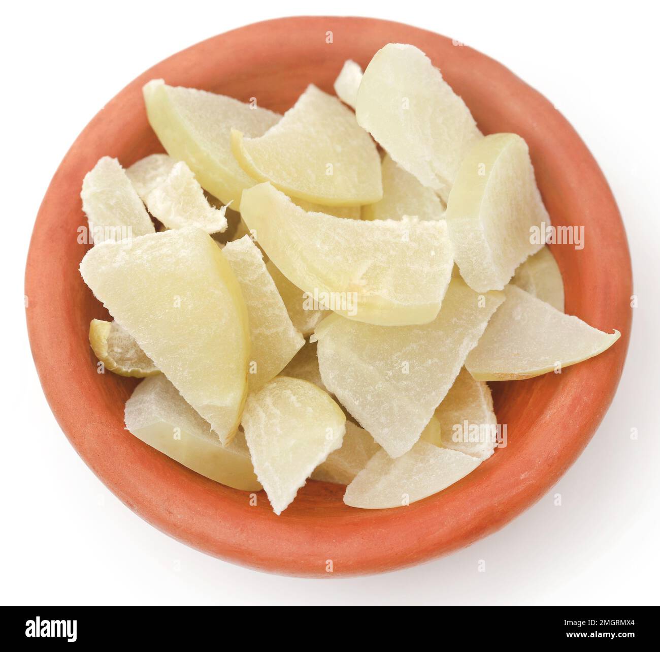 Sliced amla fruits in a bowl over white background Stock Photo - Alamy