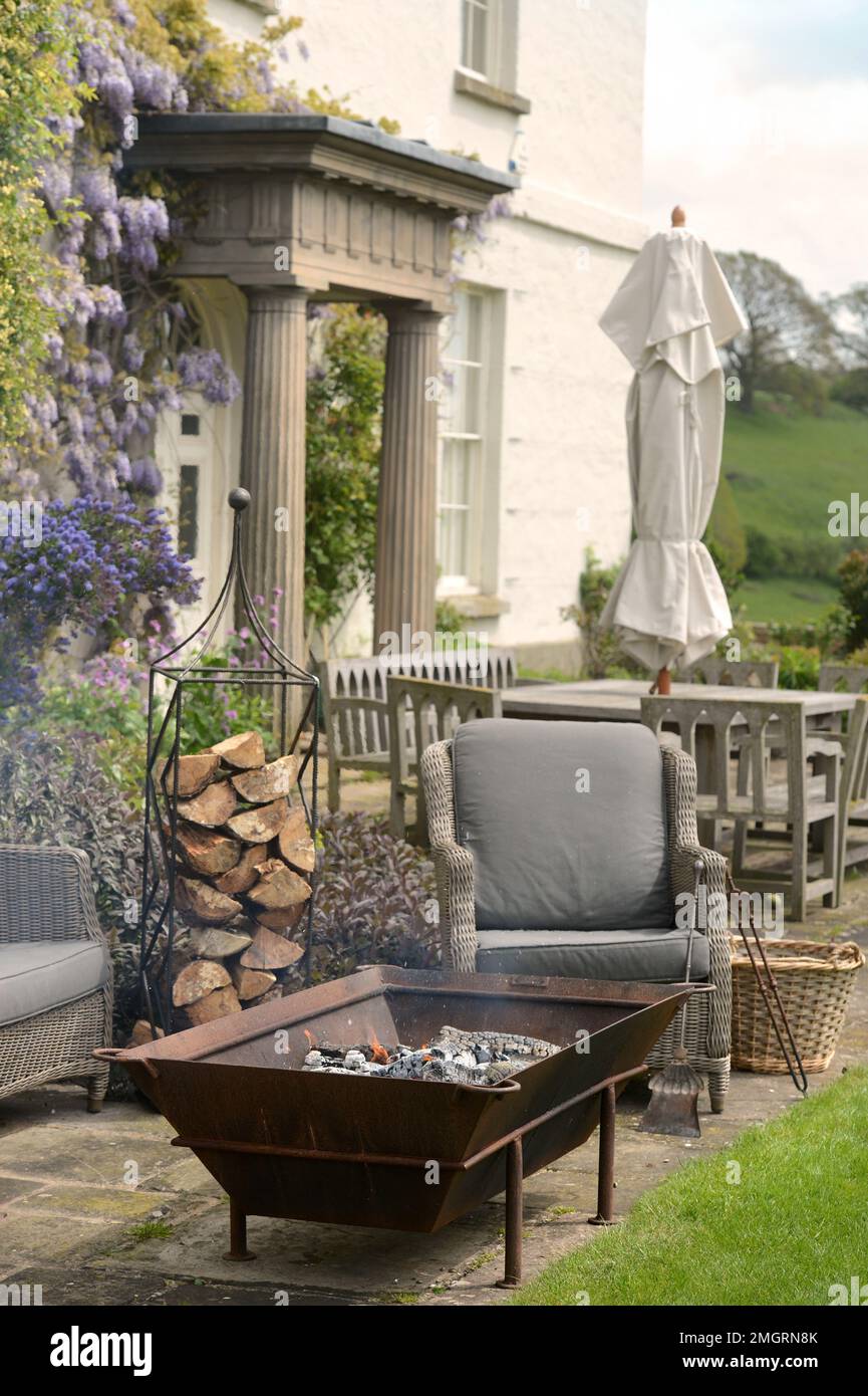 Country house with a fire pit on the terrace Stock Photo - Alamy