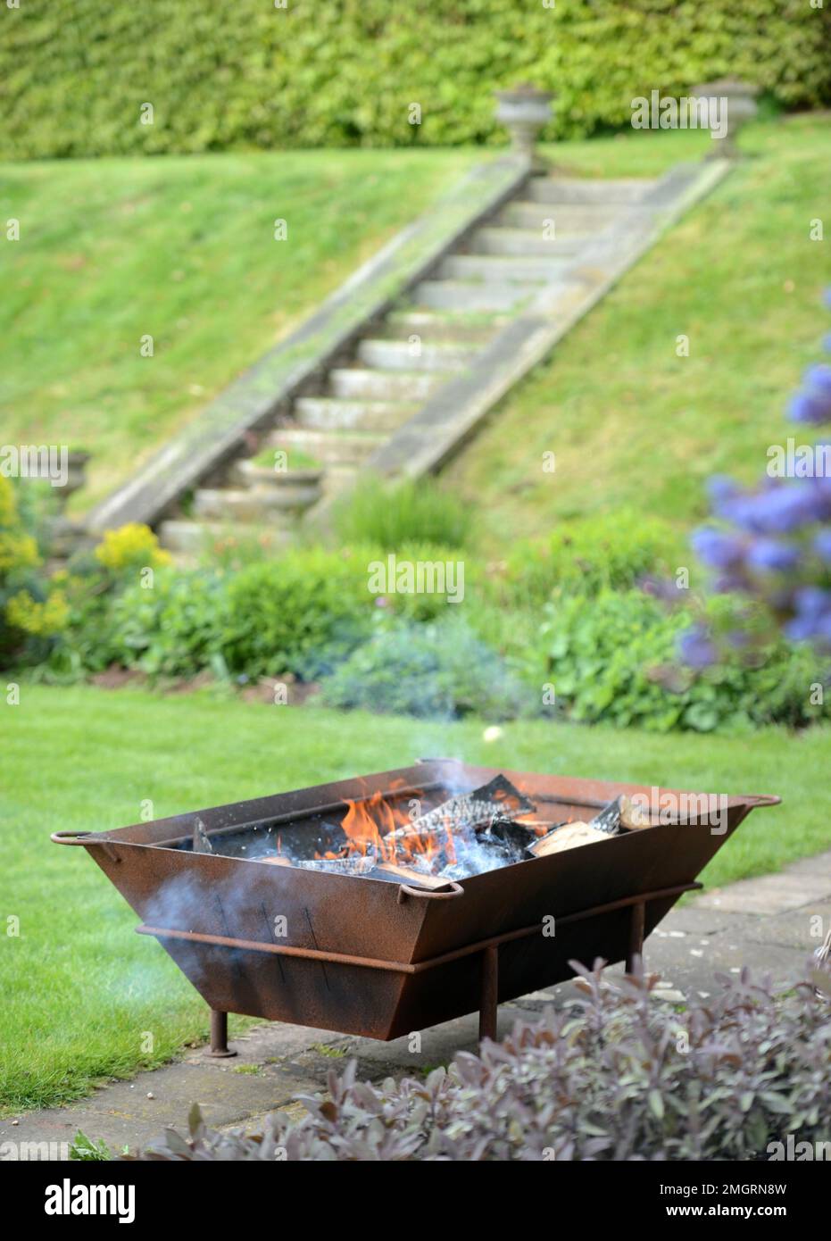 Country house with a fire pit on the terrace Stock Photo - Alamy