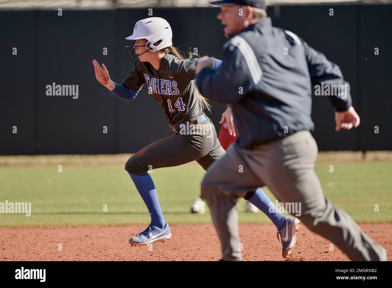 Memphis' Sam Ibison runs toward third base during an NCAA softball game ...