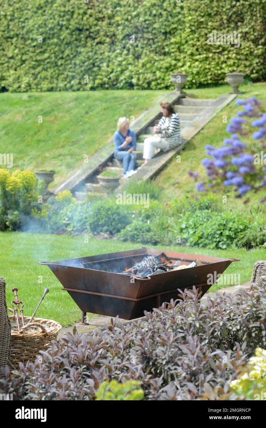 Country house with a fire pit on the terrace Stock Photo - Alamy