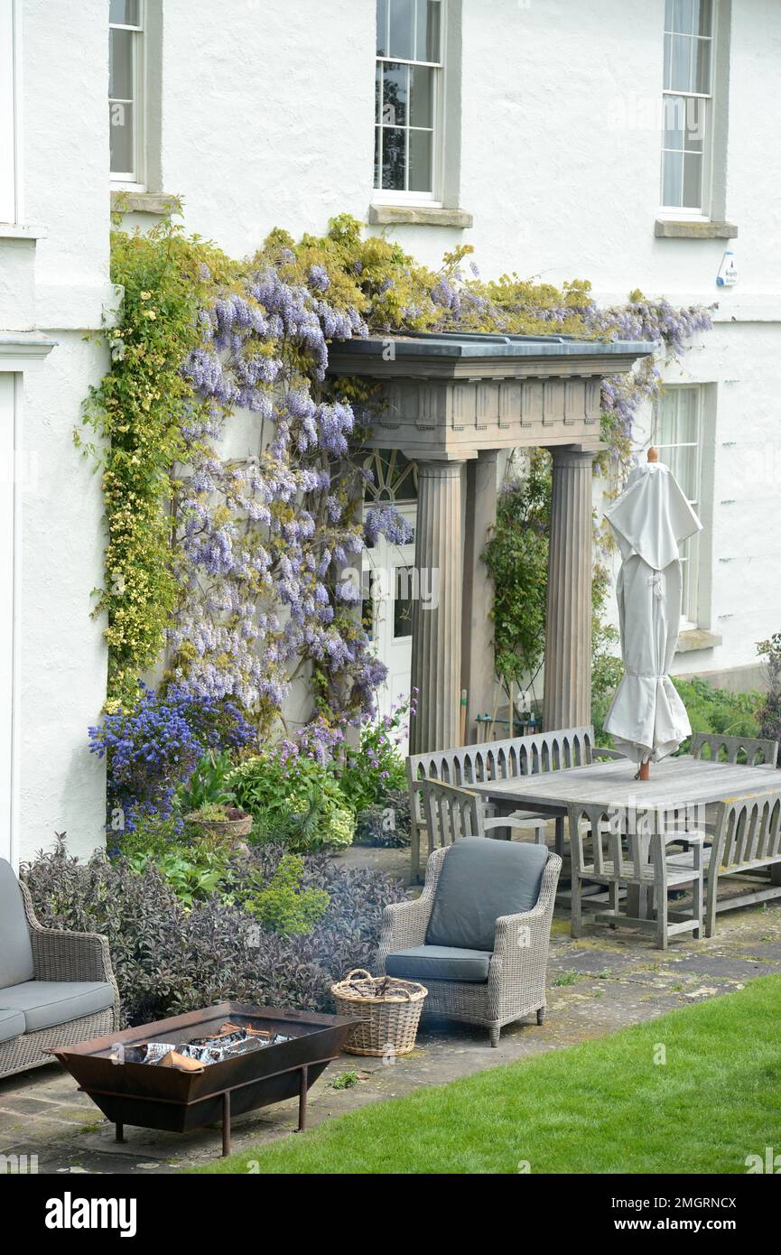 Country house with a fire pit on the terrace Stock Photo - Alamy