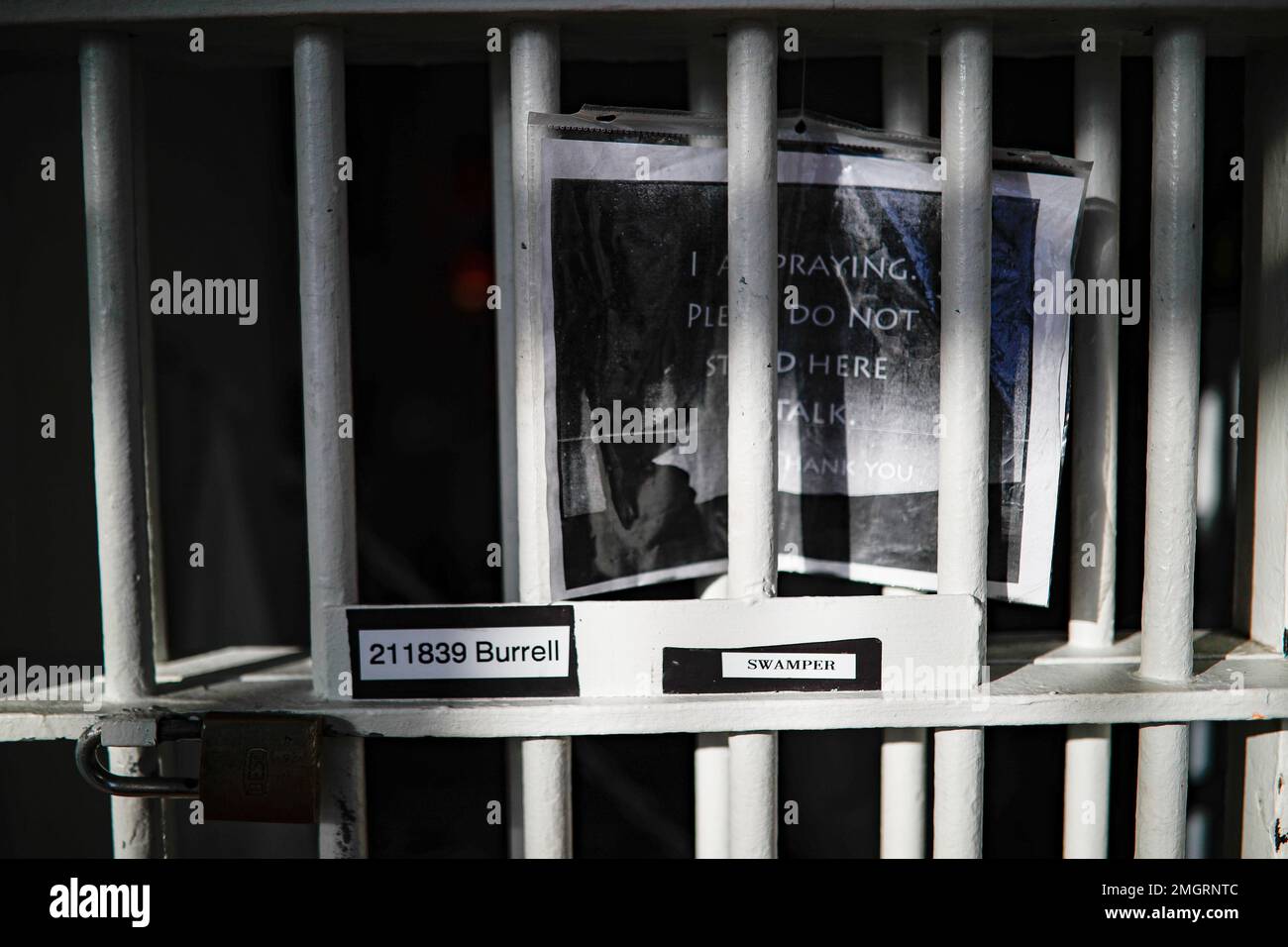 Inmate Myon Burrell hangs a sign in the bars of his cell at Minnesota ...