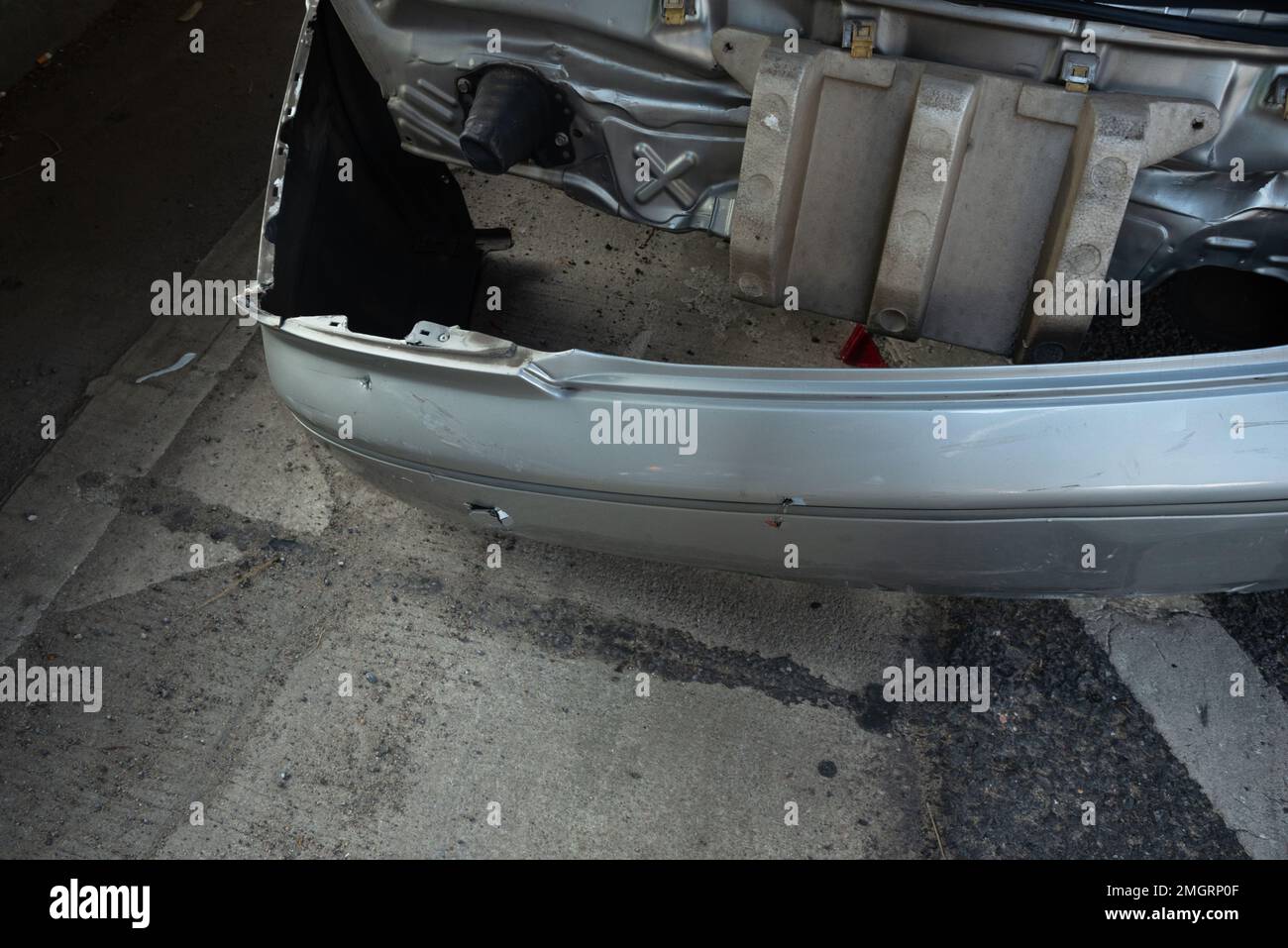 The rear bumper of the car was damaged after being hit from the rear ...