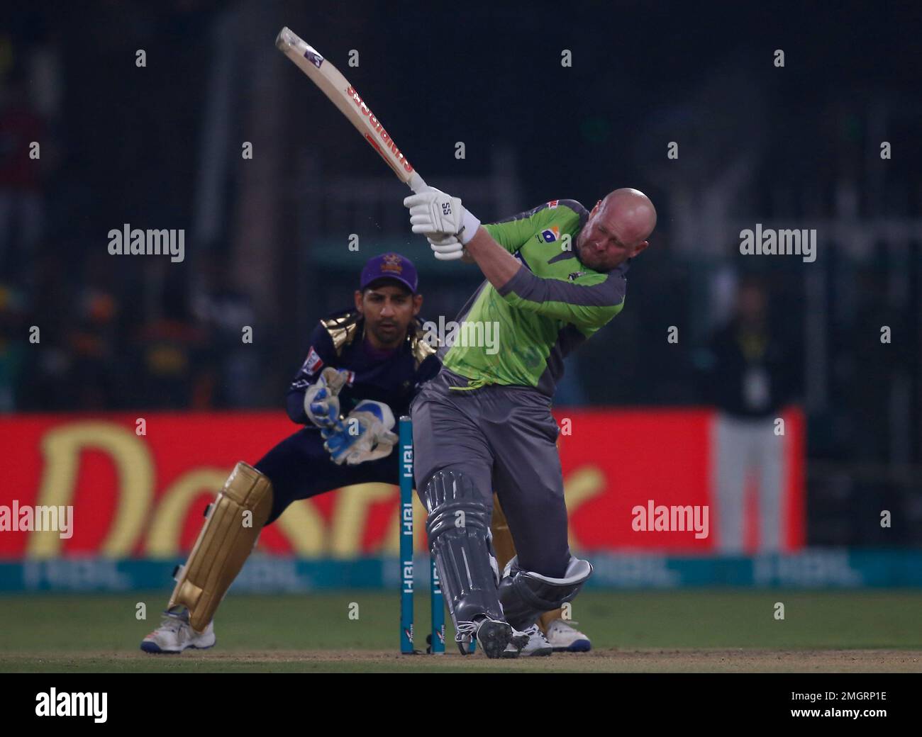 Ben Dunk of Lahore Qalandar hits boundary as Quetta Gladiators' Sarfraz ...