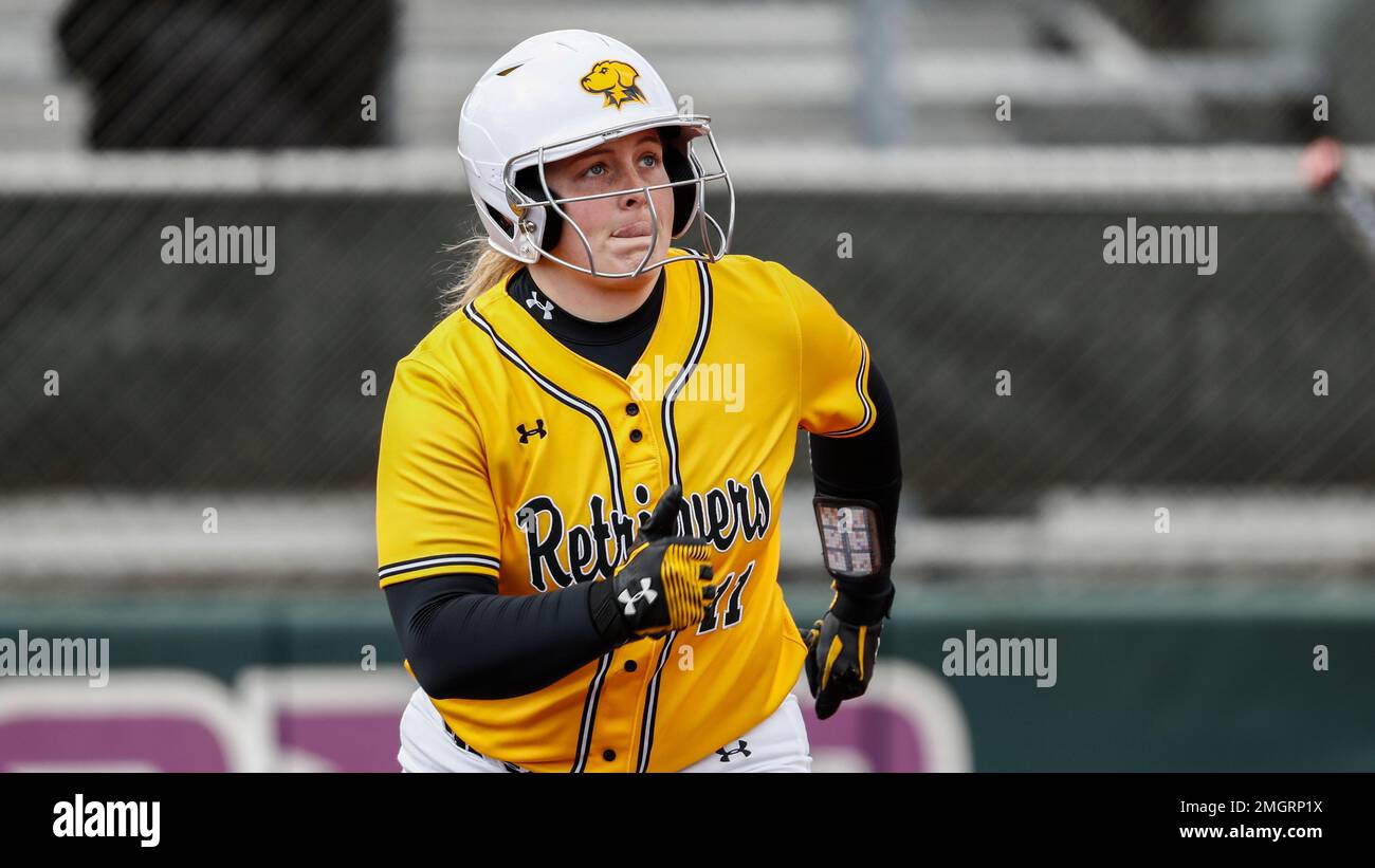 UMBC's Logan Hawker runs to first base during an NCAA softball game ...