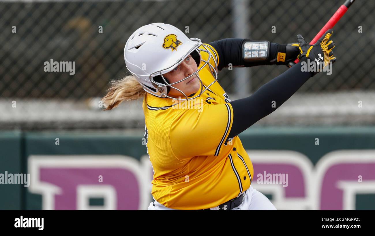 UMBC's Logan Hawker swings at a pitch during an NCAA softball game ...