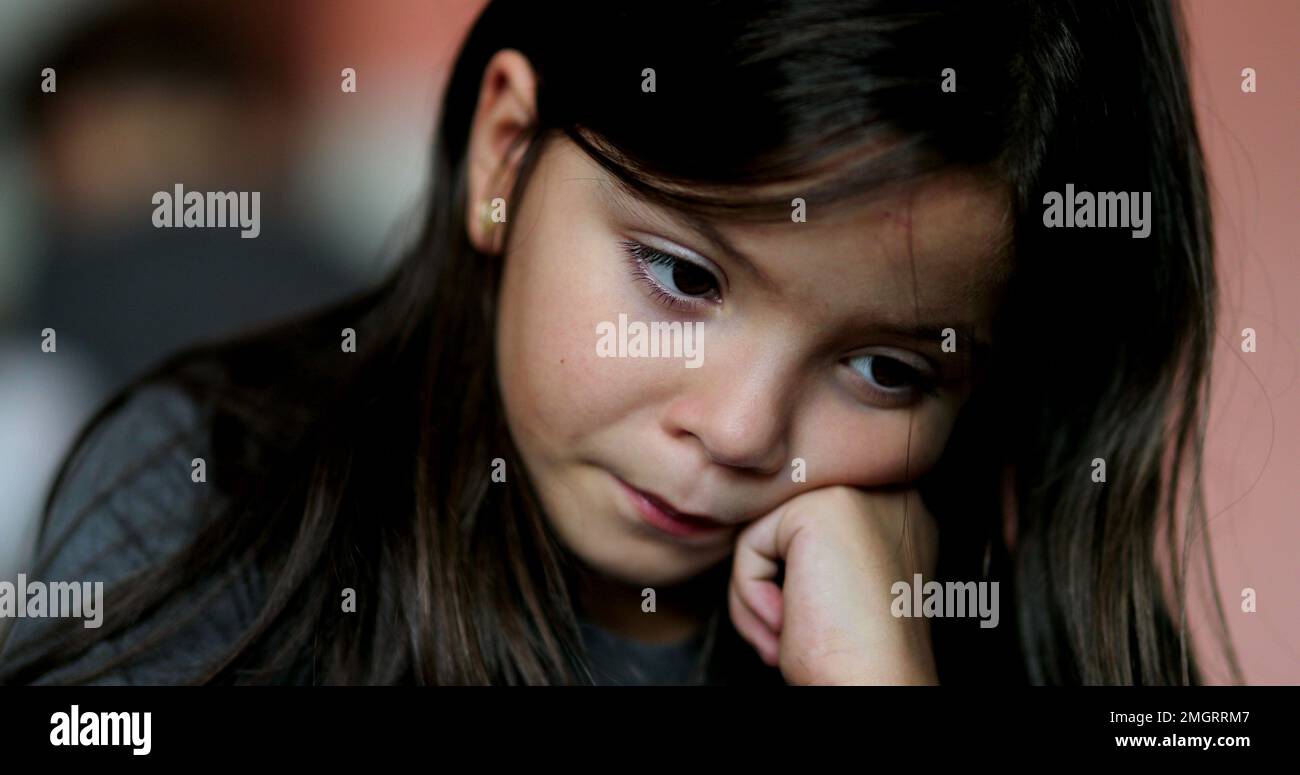 Troubled child sad kid depressed little girl Stock Photo - Alamy