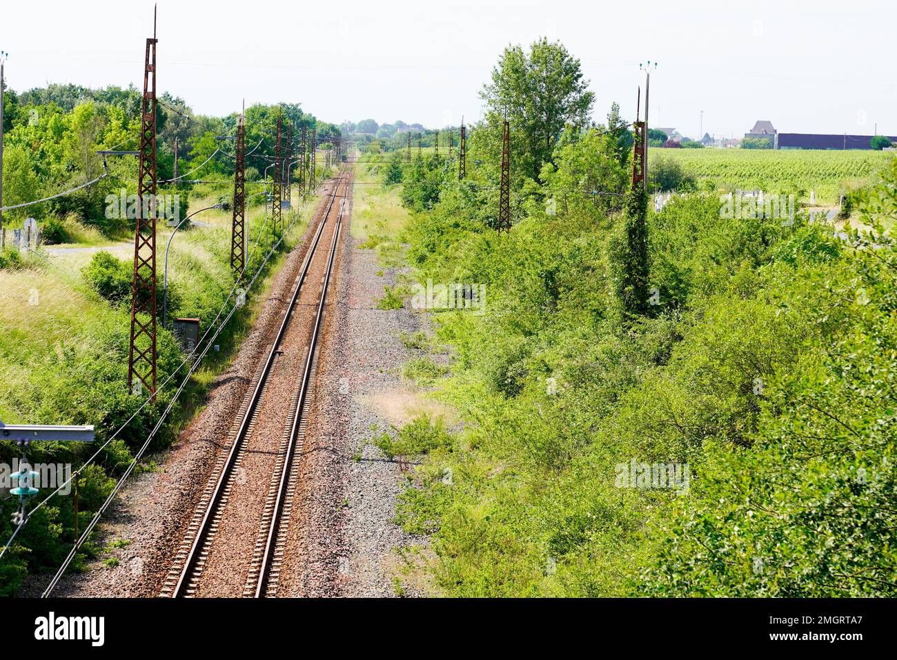train rails track and electric poles Stock Photo - Alamy