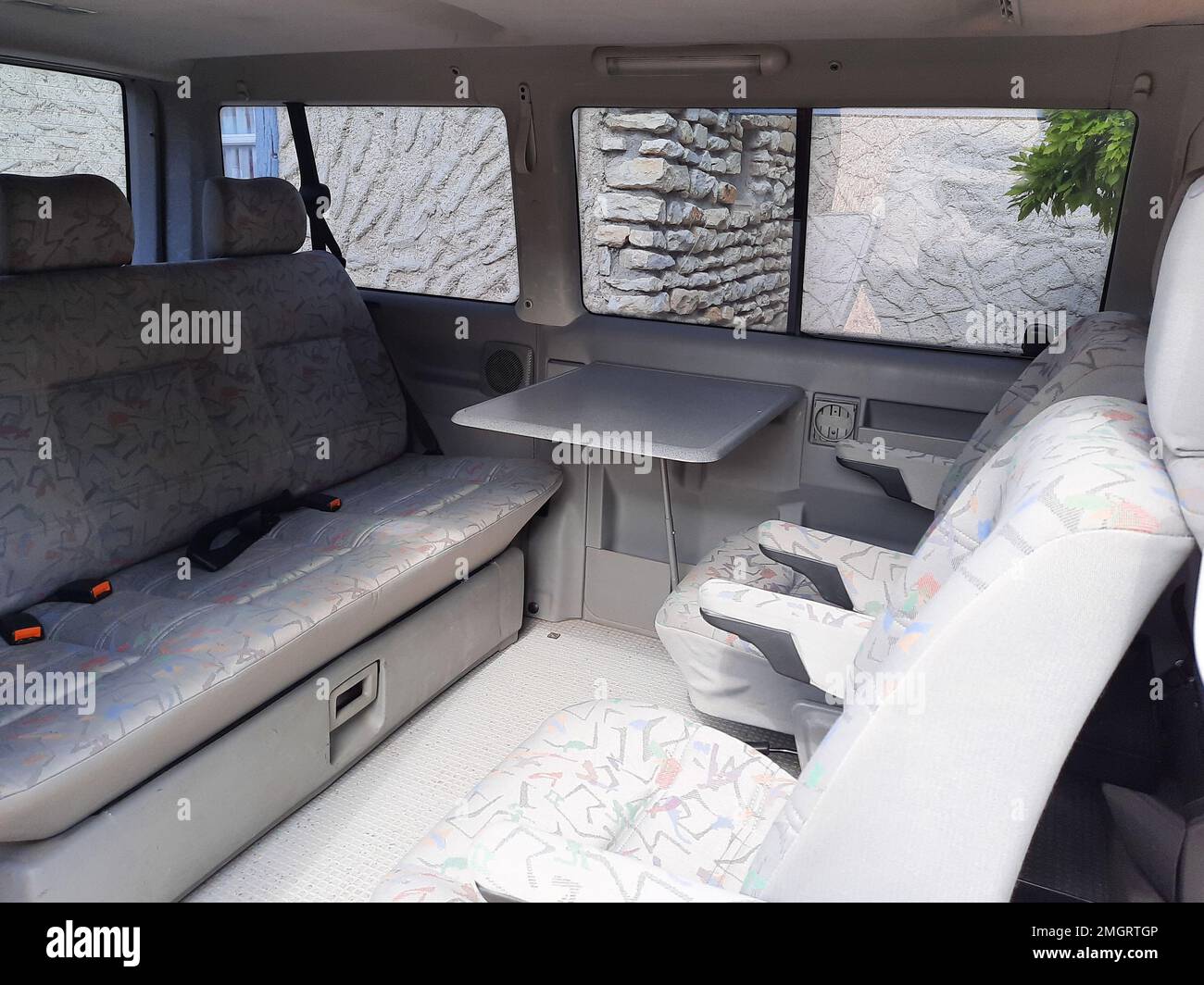 Interior of old luxury van with comfortable car passenger seat and ...
