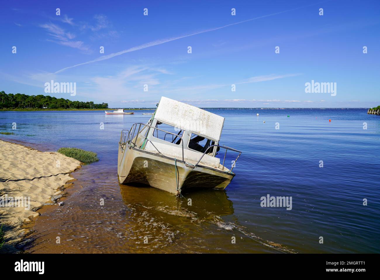 small pleasure motor boat wrecked and stranded on the beach Stock Photo ...
