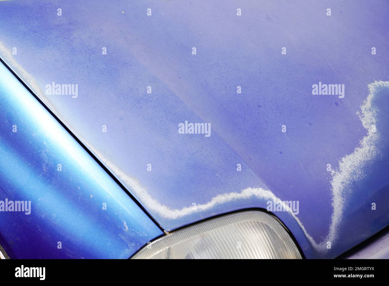 car blue painted faded engine hood with paint worn over time Stock ...