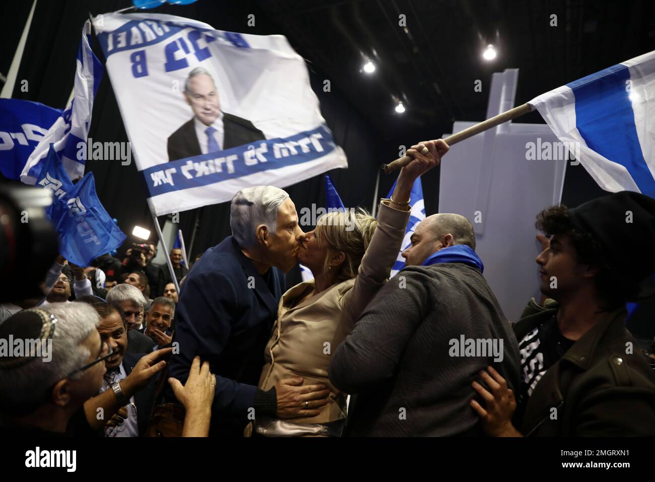 Supporters of Israeli Prime Minister Benjamin Netanyahu, one wearing a ...