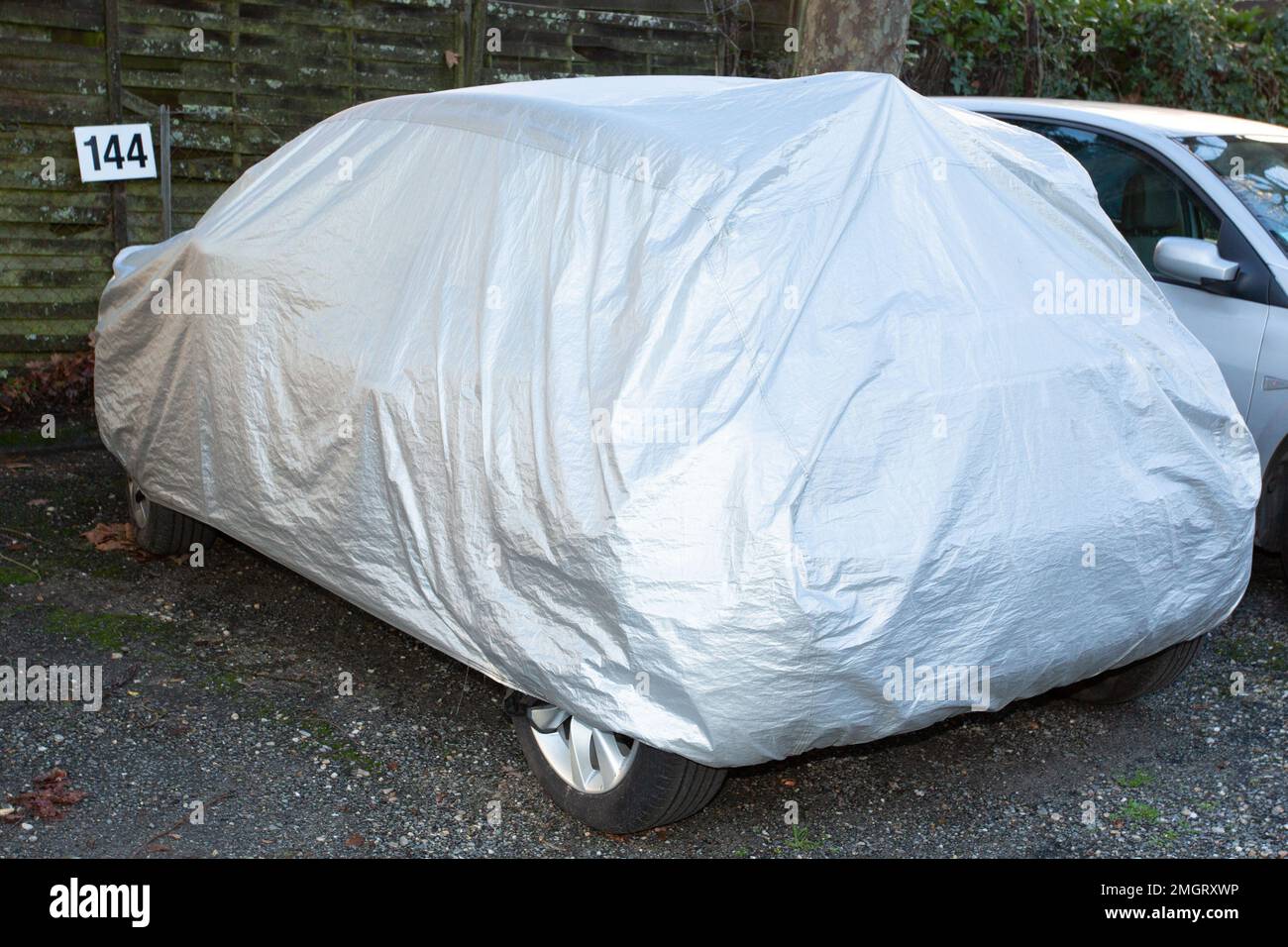 Car covered protective silver hi-res stock photography and images - Alamy