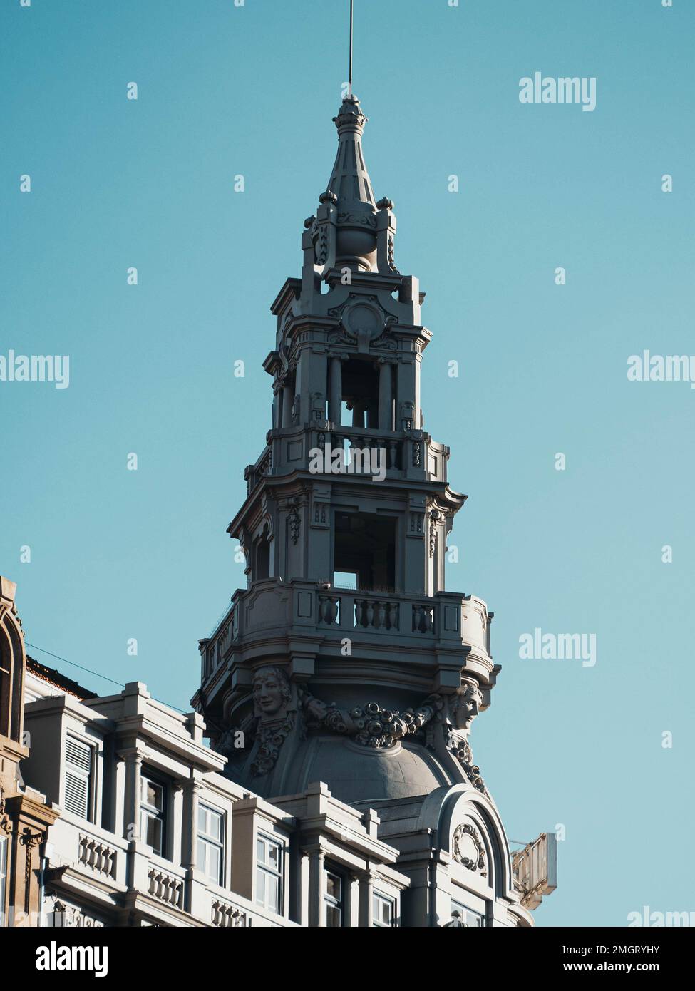 A building with some spires and windows on it's top Stock Photo - Alamy